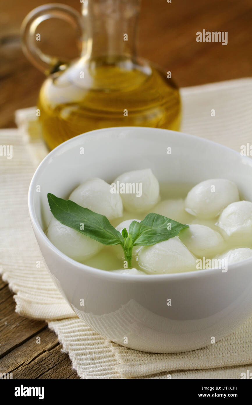 Baby mozzarella cheese balls in a bowl Stock Photo - Alamy