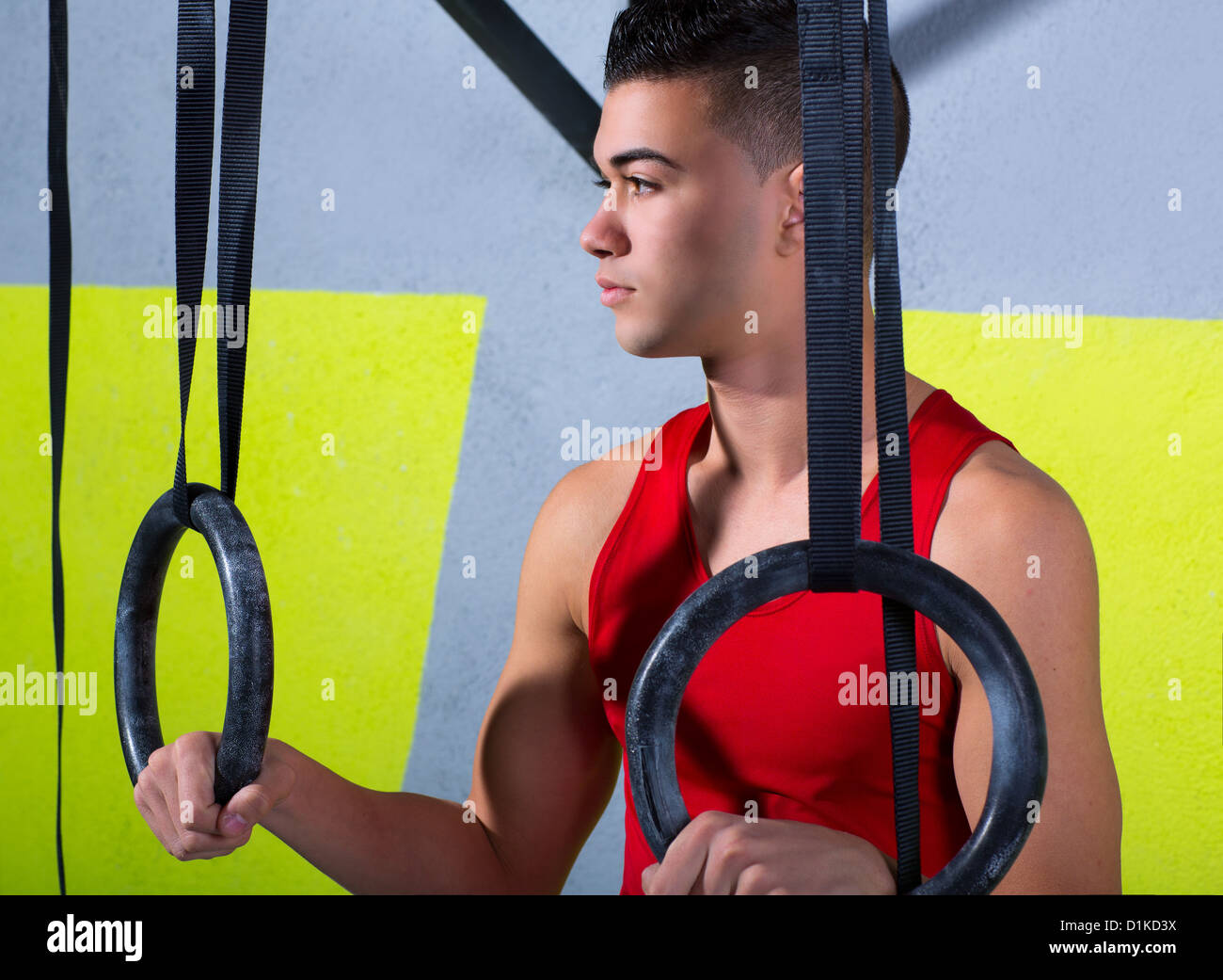 Crossfit dip ring young man relaxed after workout at gym dipping ...