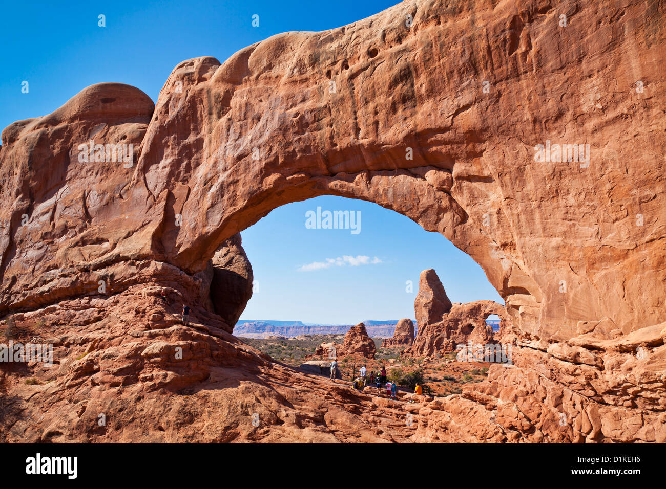 Tourists and Turret arch from North Window arch Arches National Park ...