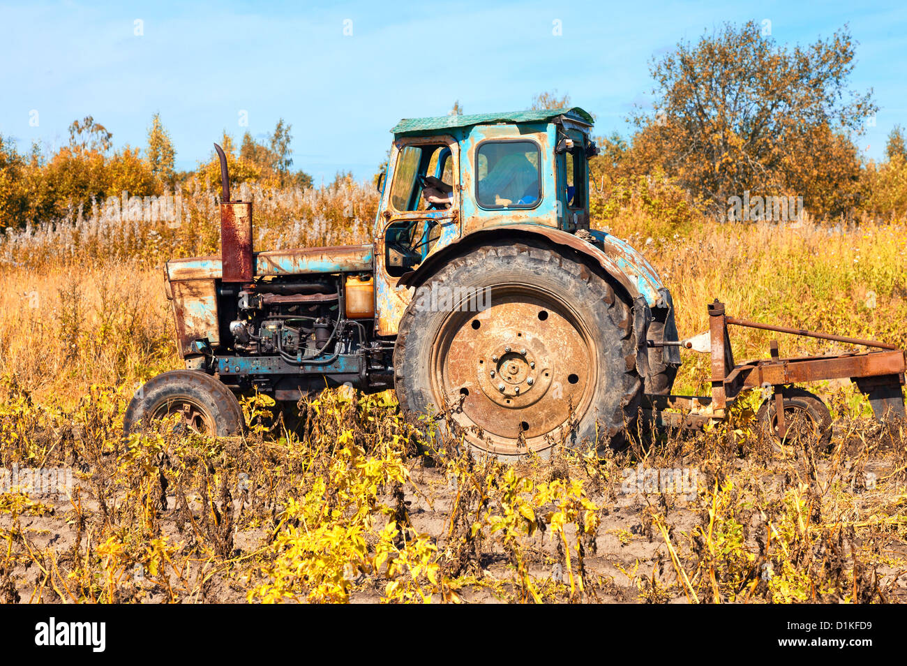 Old tractor in the field Stock Photo - Alamy