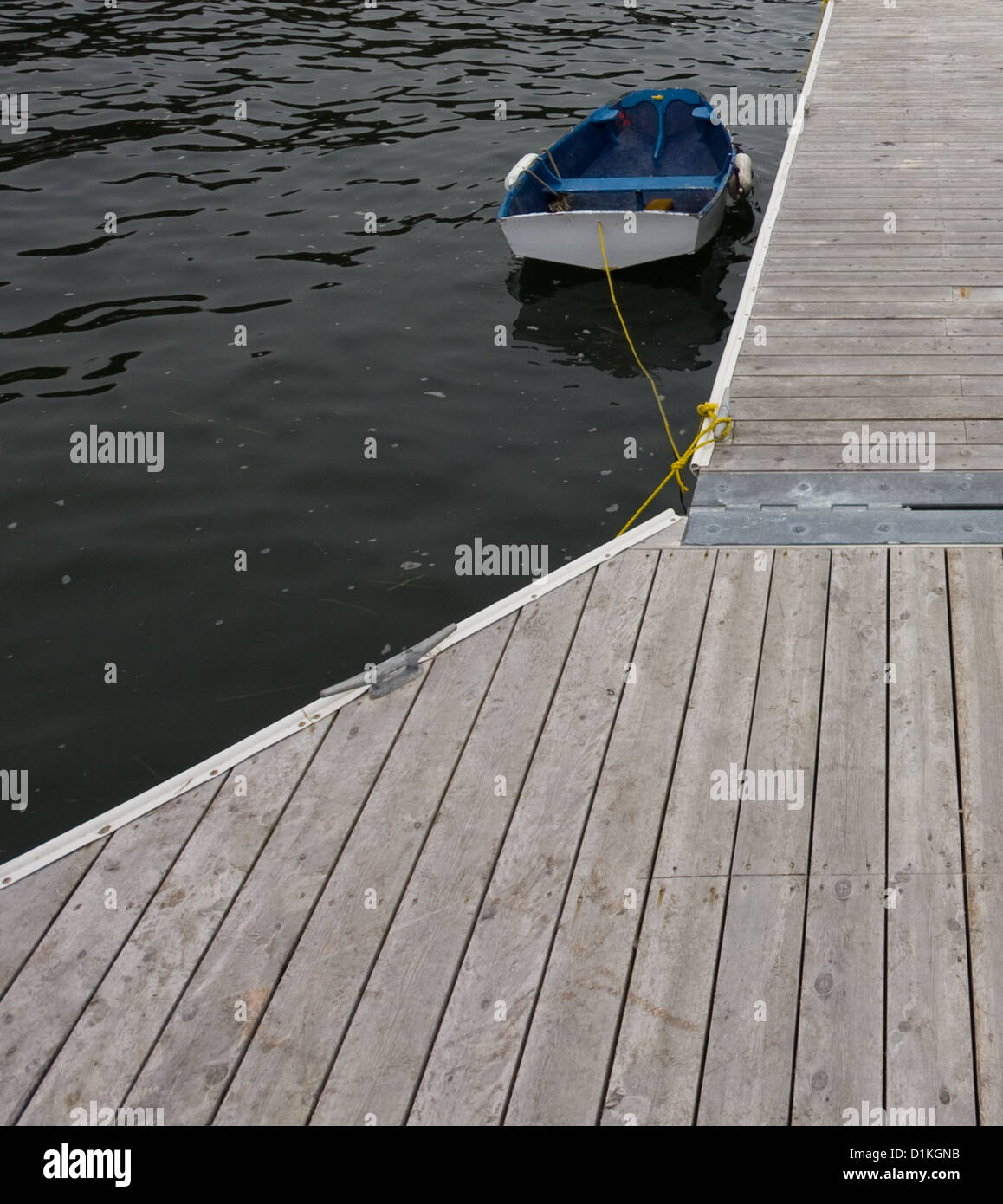Row boat tied to a dock Stock Photo - Alamy