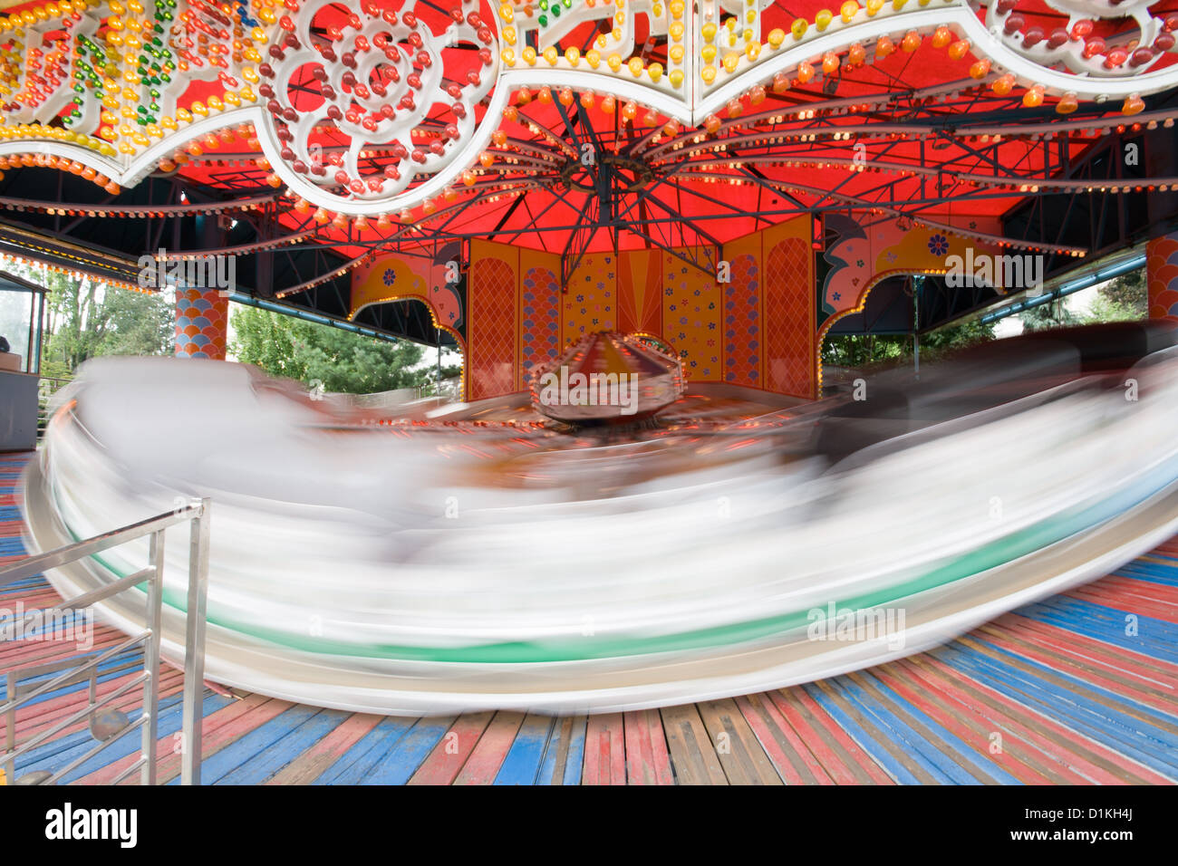 Fast moving amusement park ride Stock Photo - Alamy