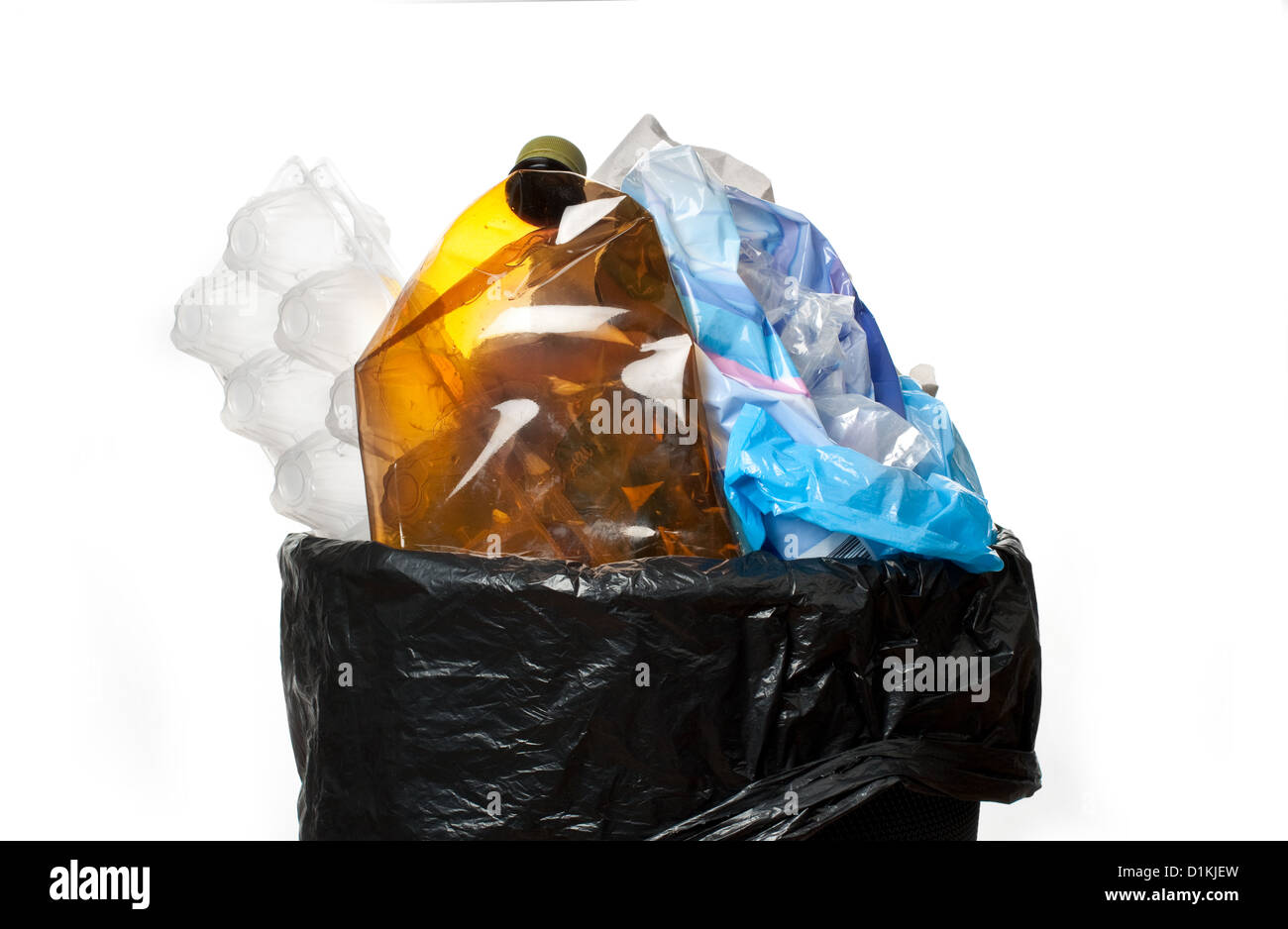 Full trash bin, isolated on white Stock Photo - Alamy