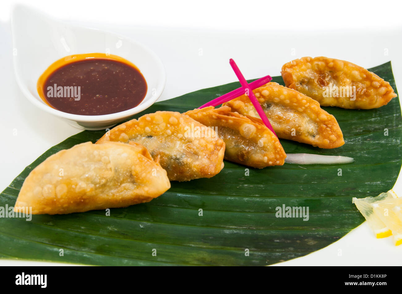 Japanese dumplings with lettuce on white background Stock Photo - Alamy