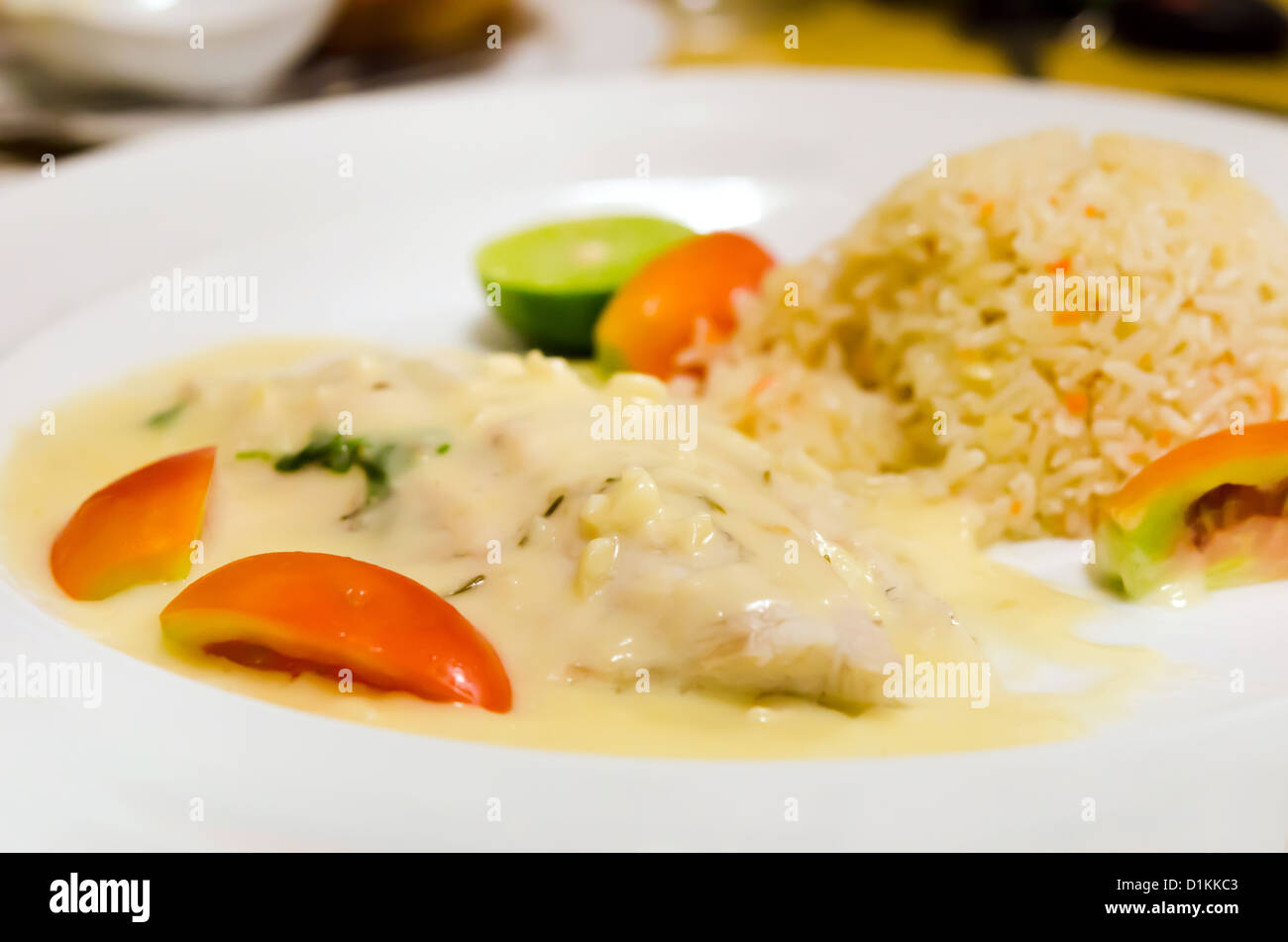 steak from fish with creamy sauce and fried rice Stock Photo - Alamy