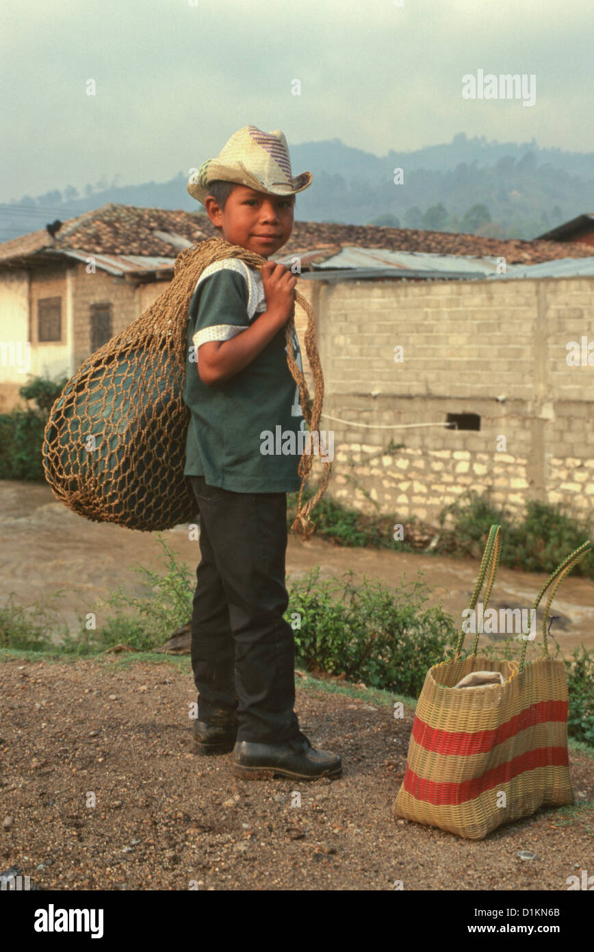 Child carrying goods in a market place in Honduras Stock Photo - Alamy