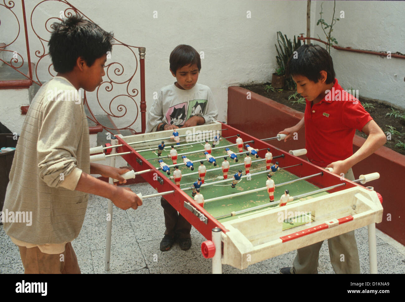 Children play table football in a shelter for homeless children in ...