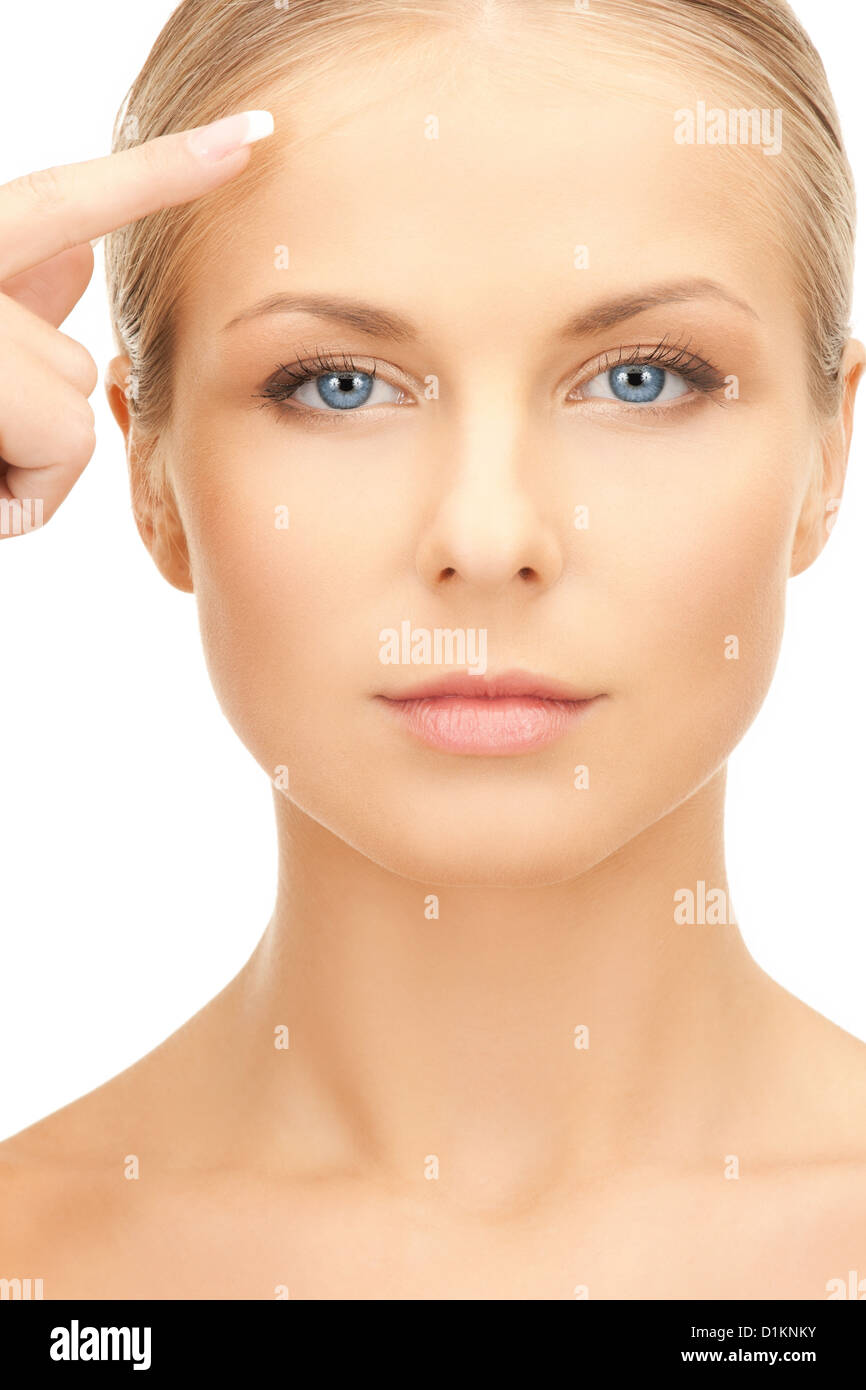 beautiful woman pointing to forehead Stock Photo - Alamy