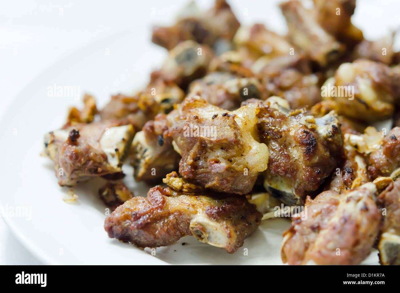 close up fried pork spare ribs with garlic and pepper Stock Photo - Alamy