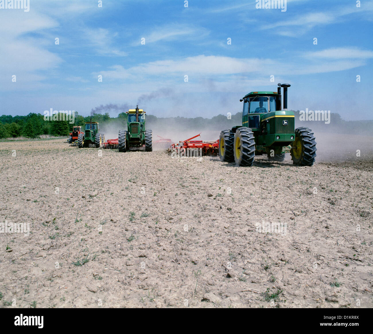 DISKING AND APPLYING PESTICIDE TO CORN GROUND Stock Photo - Alamy