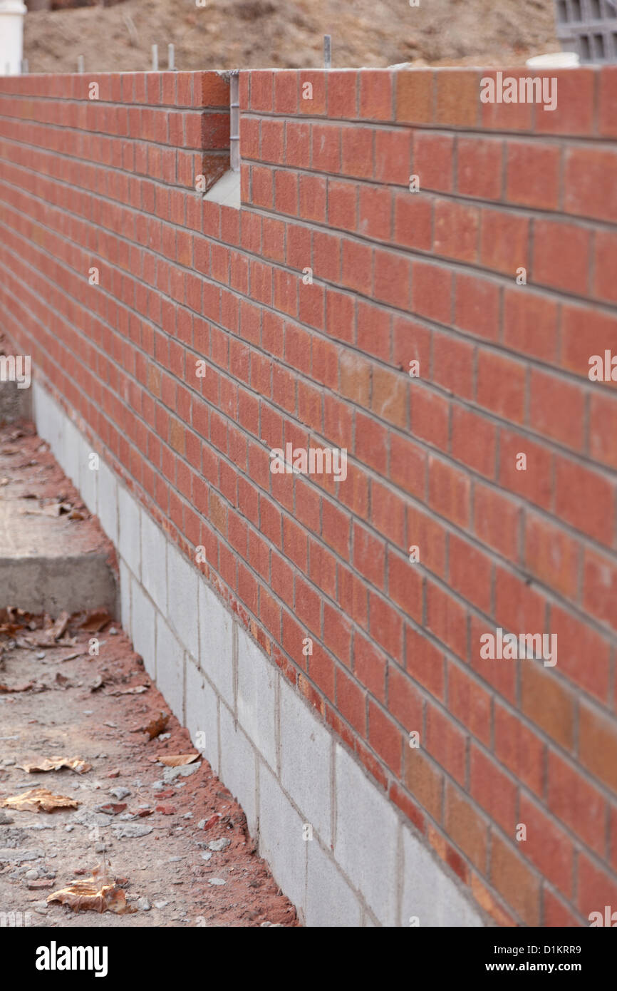 New brick wall of a basement for a home under construction Stock Photo ...
