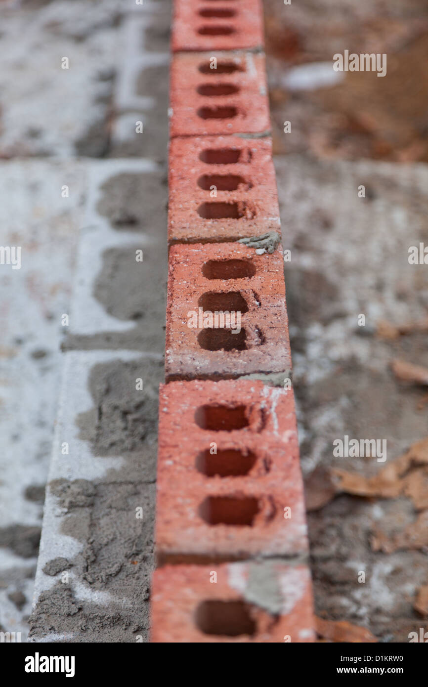 Details on the construction of a brick wall for a new home Stock Photo ...