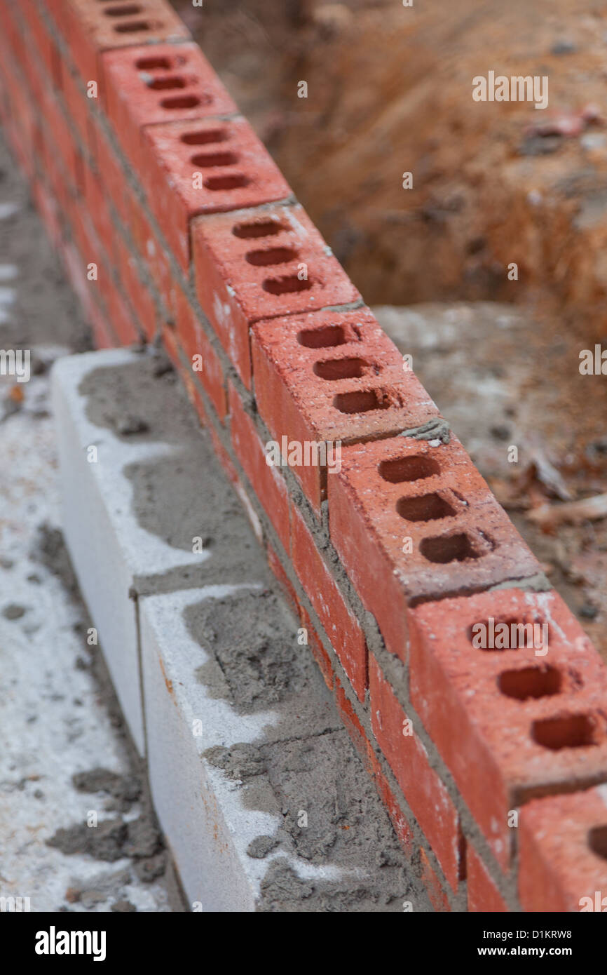 Details on the construction of a brick wall for a new home Stock Photo ...