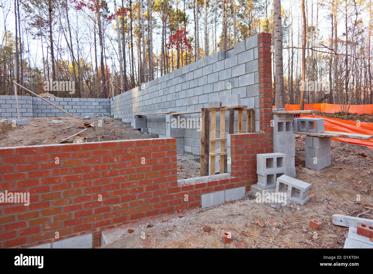 Constructing brick walls for the basement of a new home Stock Photo - Alamy
