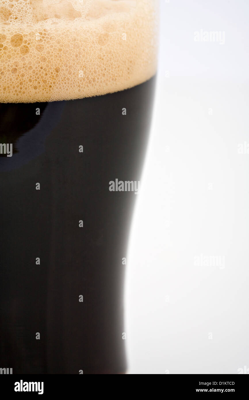A pint of stout dark beer Stock Photo - Alamy