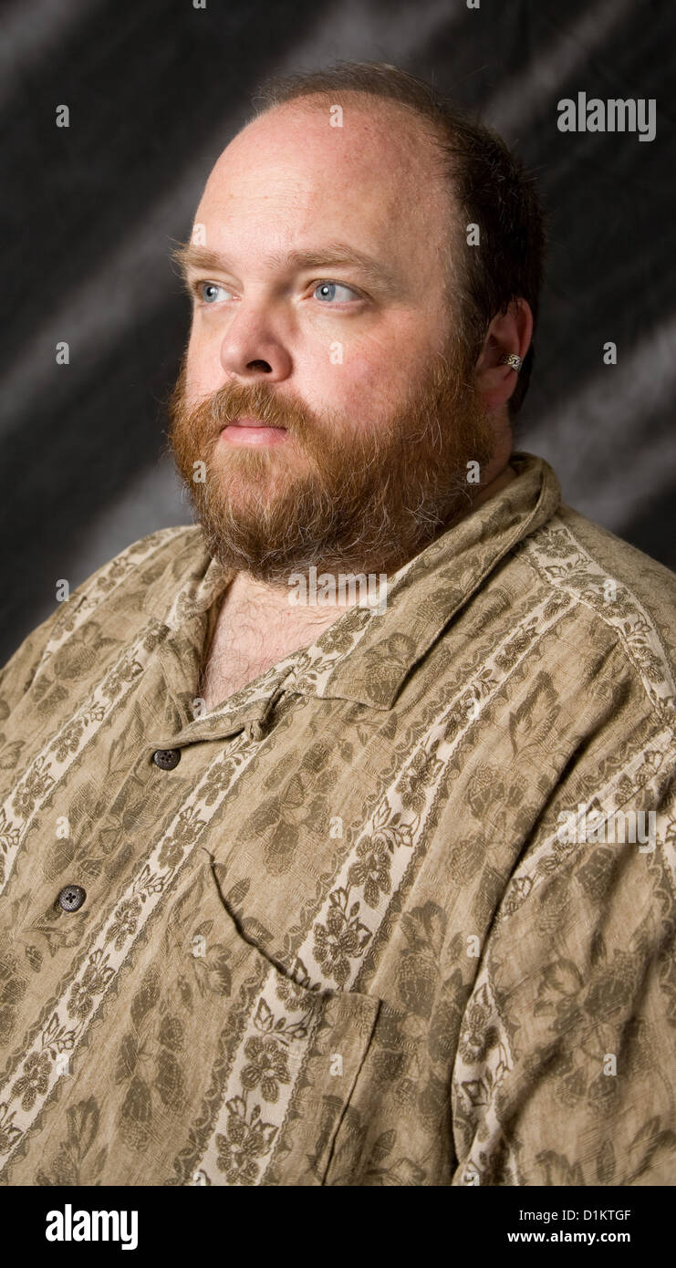 obese middle aged man posing in studio shot Stock Photo - Alamy