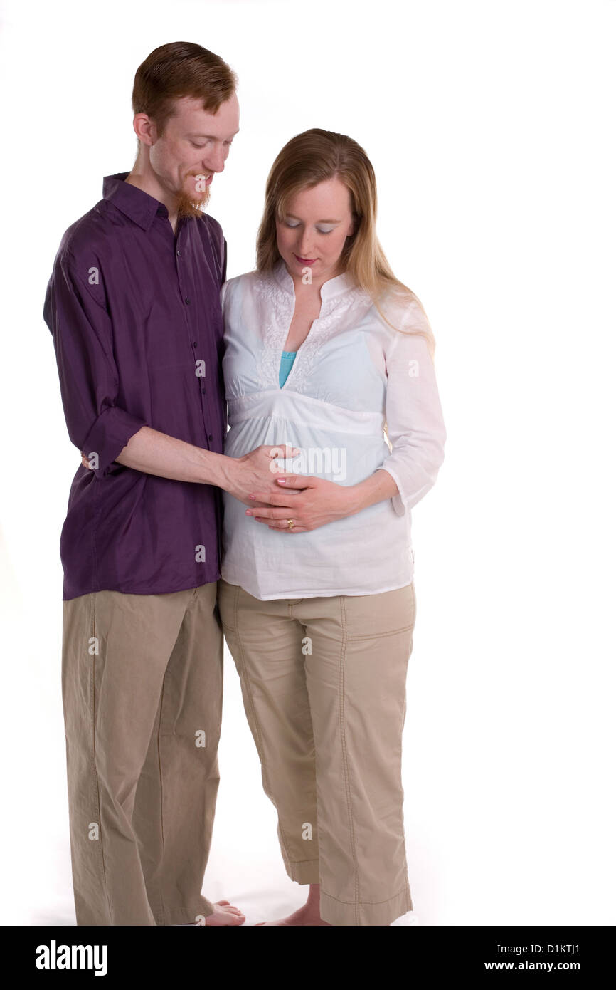 Expectant parents feeling the movements of their unborn child Stock ...