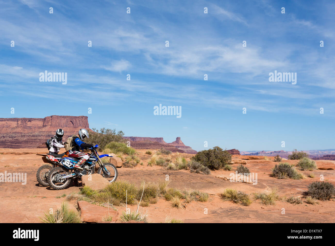 Two bikers riding dirt bikes at the Canyonlands National Park, Utah ...