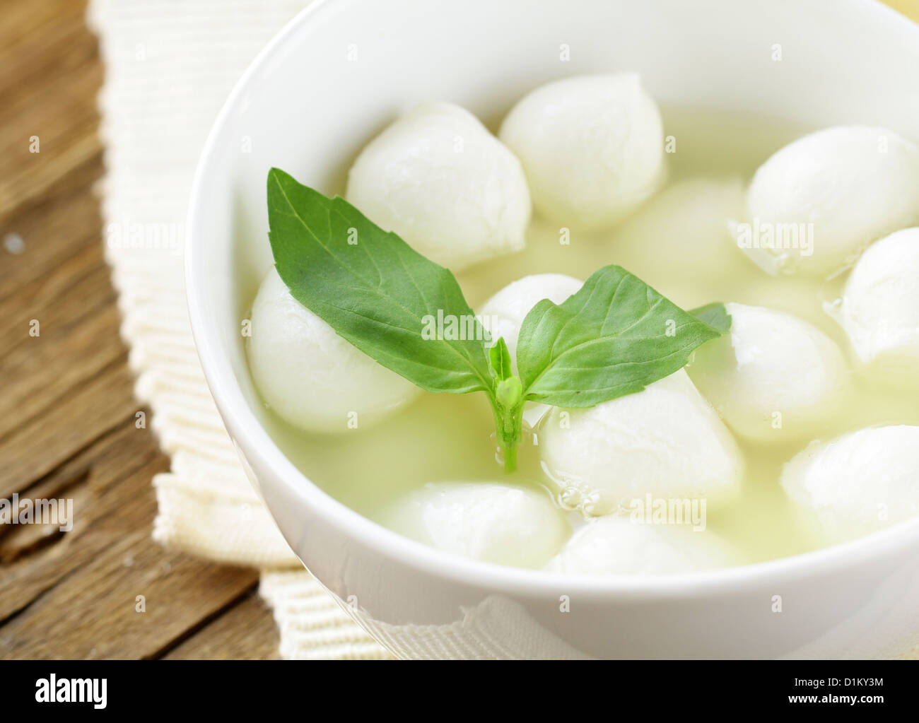 Baby mozzarella cheese balls in a bowl Stock Photo - Alamy
