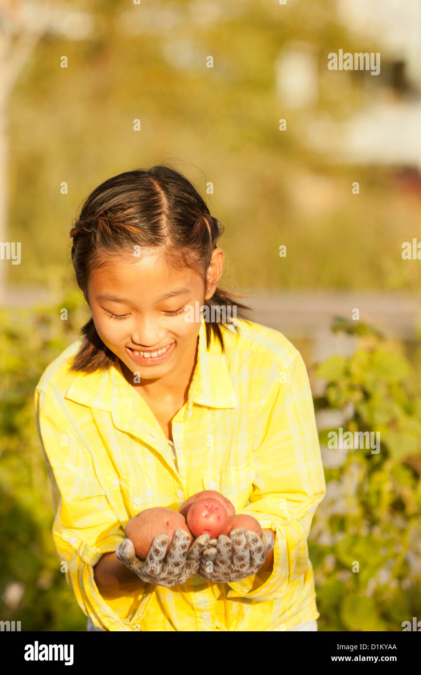 Holding potato hi-res stock photography and images - Alamy