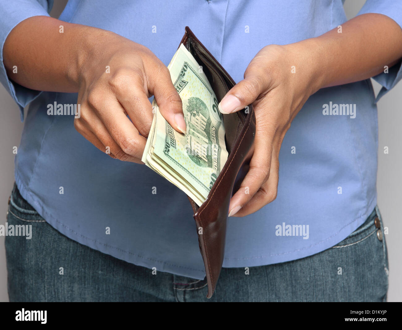 business person holding wallet with money Stock Photo - Alamy