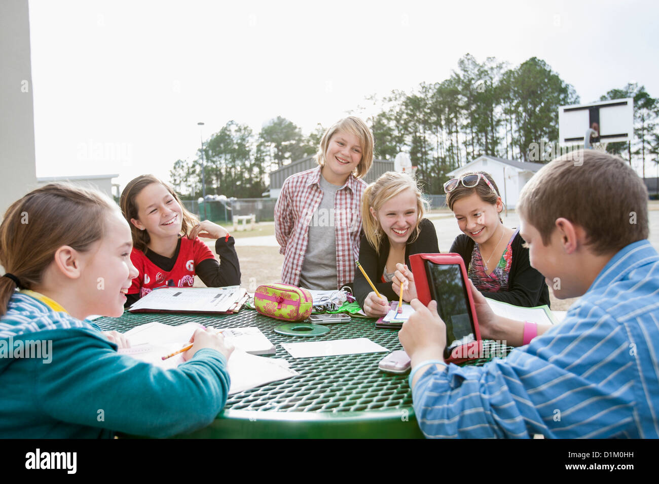 Caucasian friends doing homework together Stock Photo - Alamy