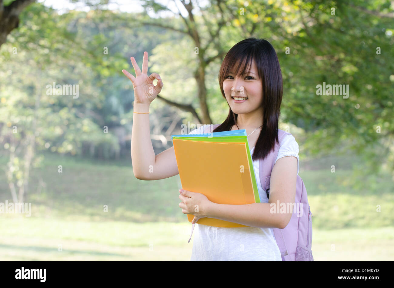 asian college student studying outdoor, ok sign Stock Photo - Alamy