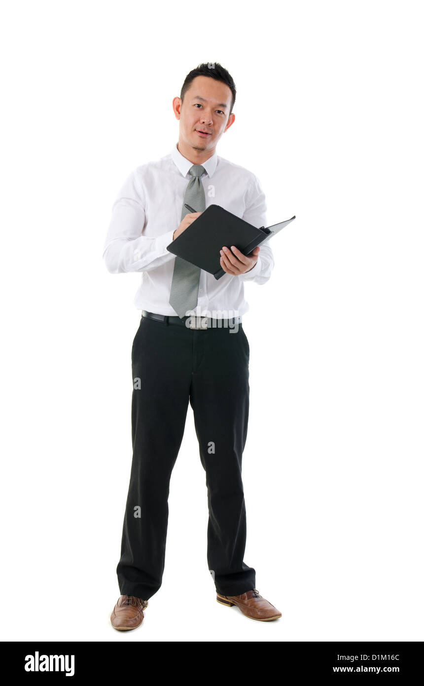 asian business man writing notes Stock Photo - Alamy