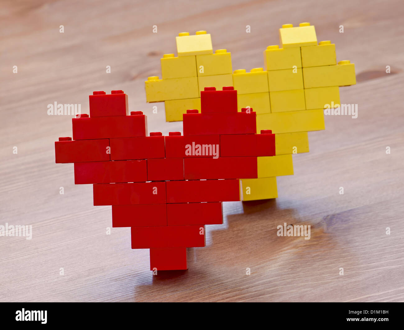 Red building blocks shaped as a heart Stock Photo - Alamy