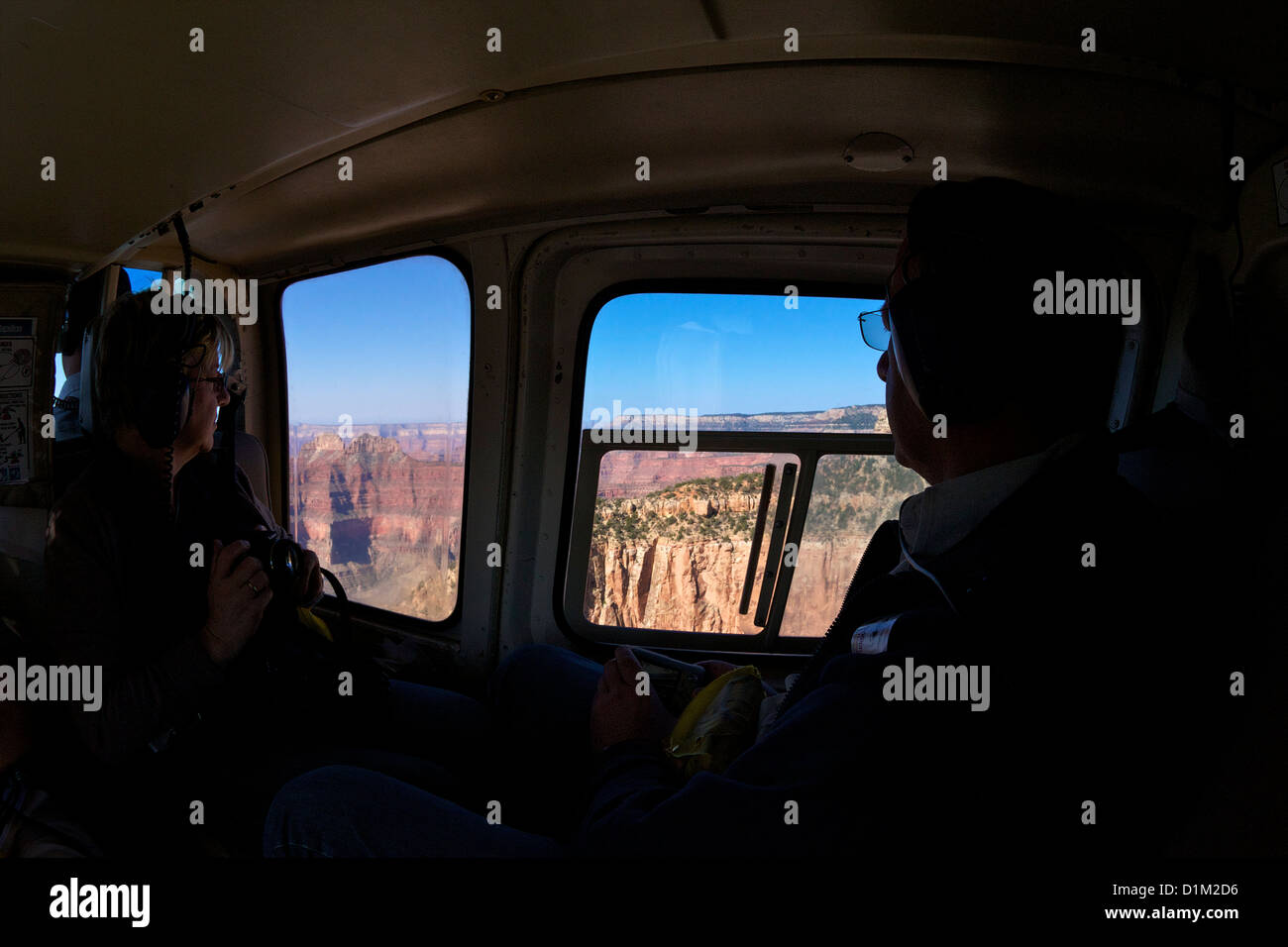 Tourists admire views of Grand Canyon from Papillon Helicopter, Grand ...