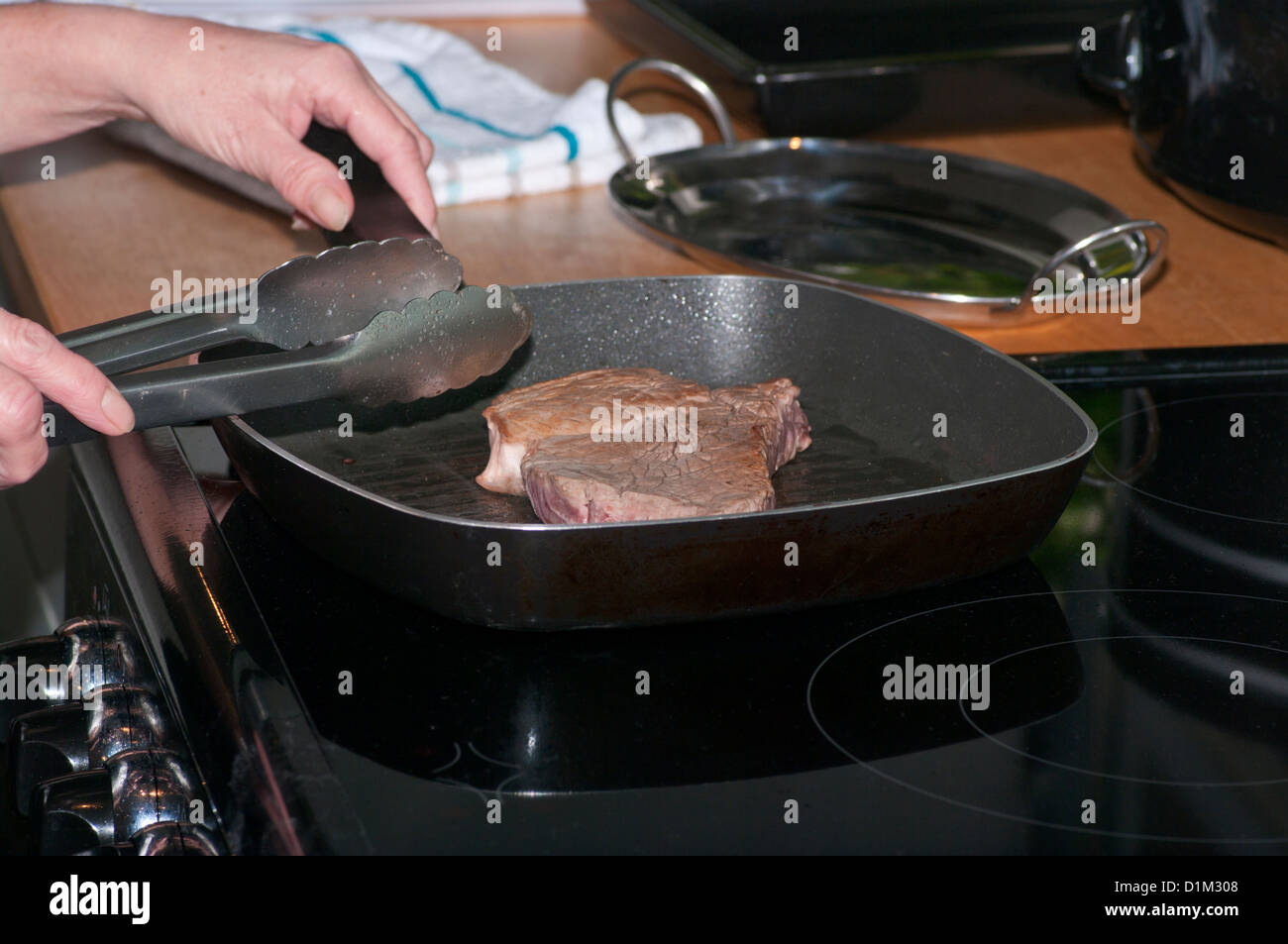 Person Frying A Fillet Steak On A Griddle Pan Stock Photo - Alamy