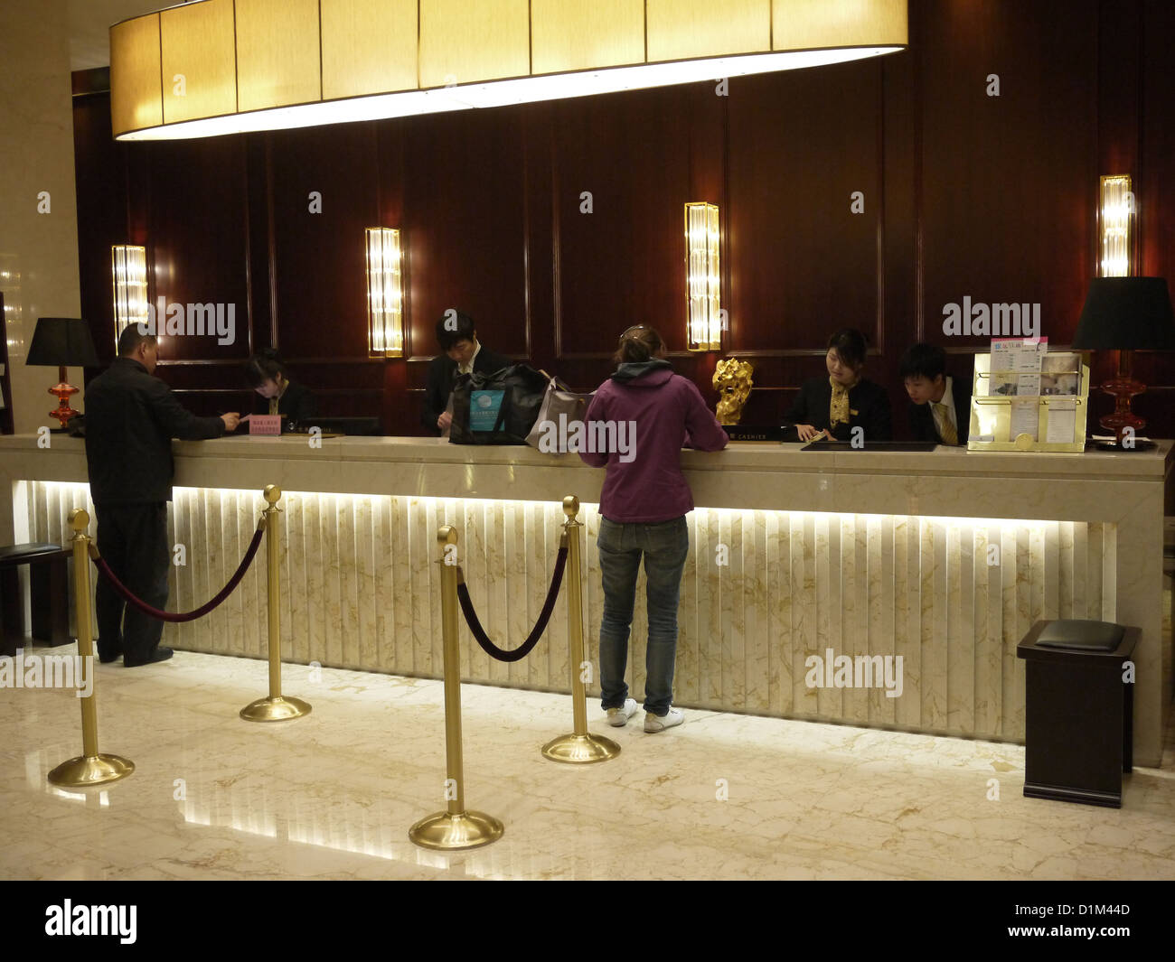hotel check in counter china Stock Photo - Alamy