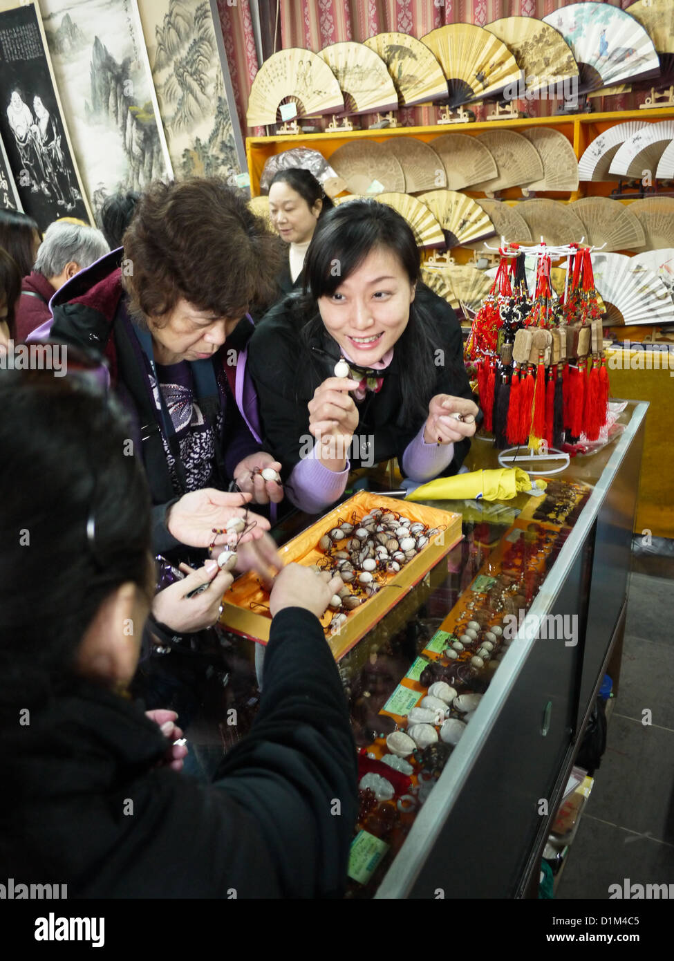 chinese woman happy buying gift oriental shop Stock Photo - Alamy