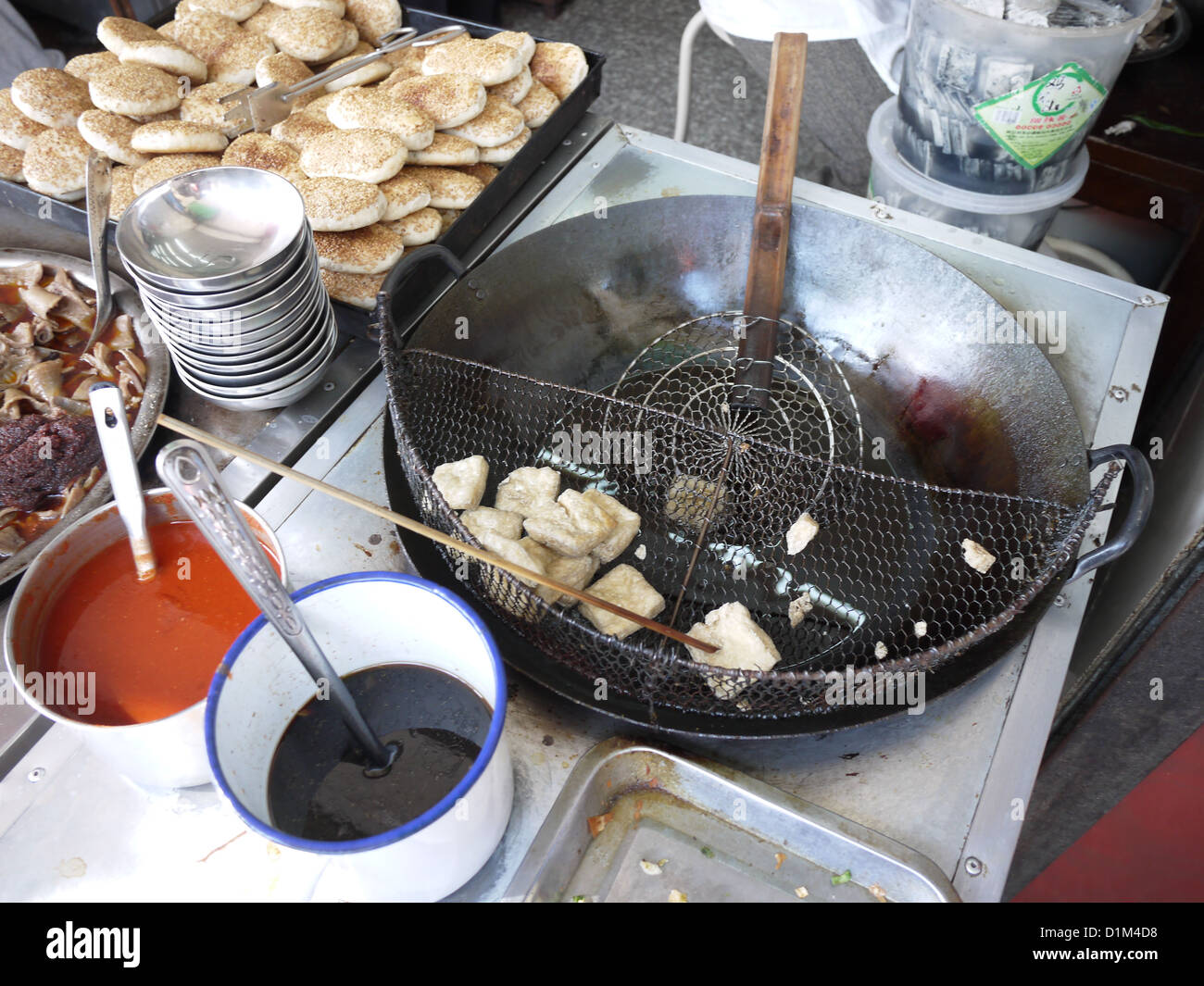 cooking chinese deep fried snack stinky tofu Stock Photo - Alamy