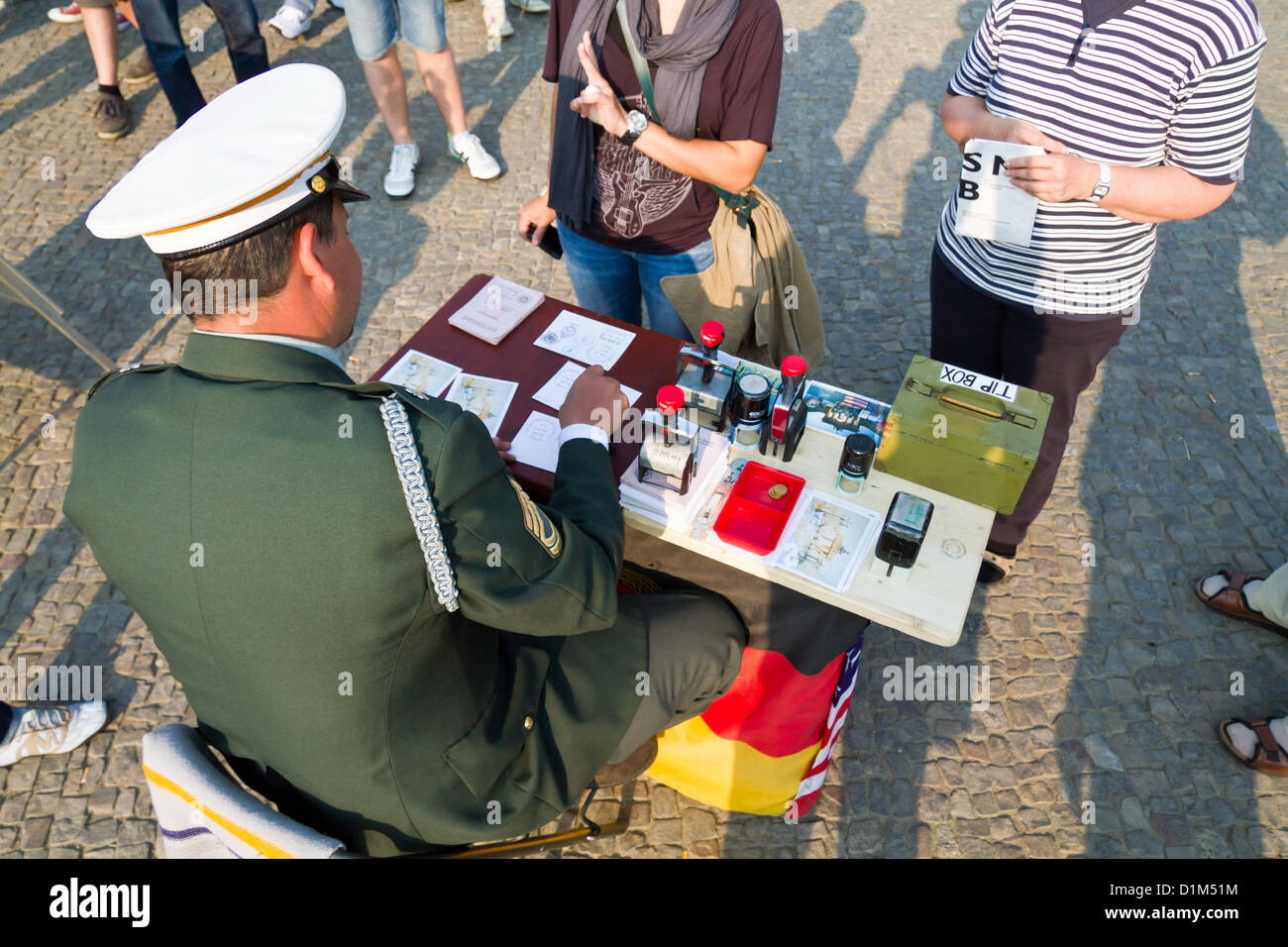 Actors performing as former East German Border Officers issuing Visa at ...