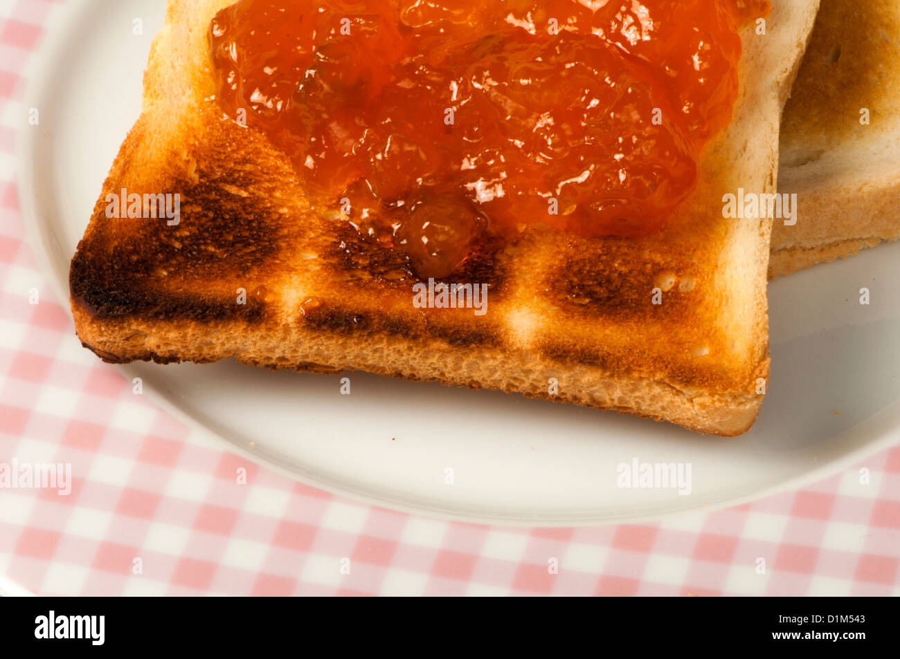 Spread jam on bread Stock Photo - Alamy