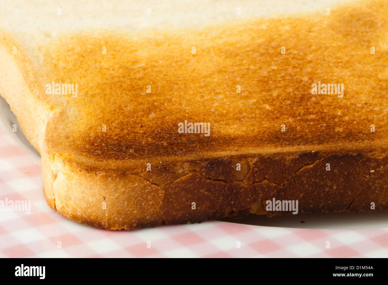 Toasted bread in a pink checkered plate Stock Photo - Alamy