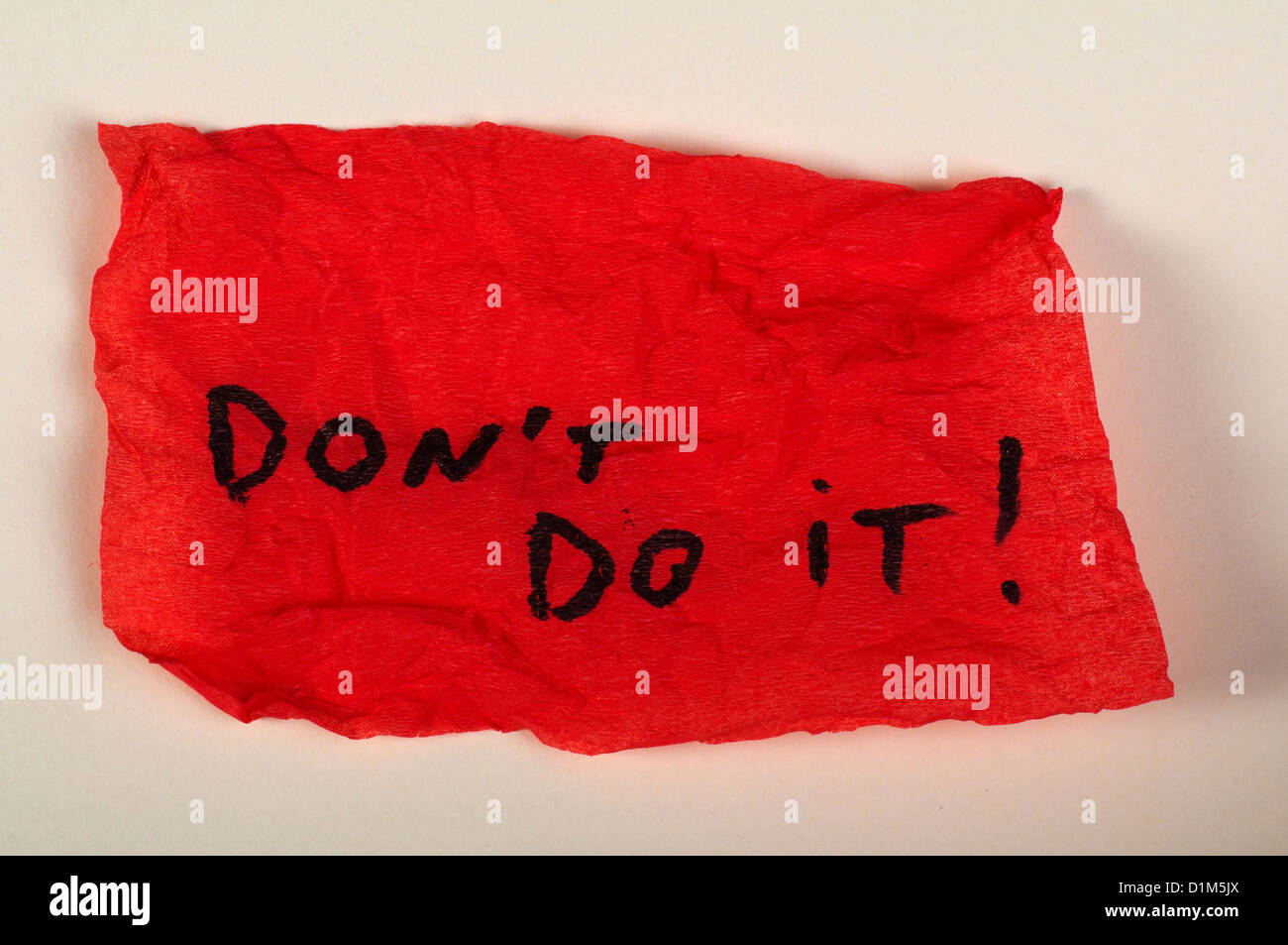 Text do not do it on red background Stock Photo - Alamy