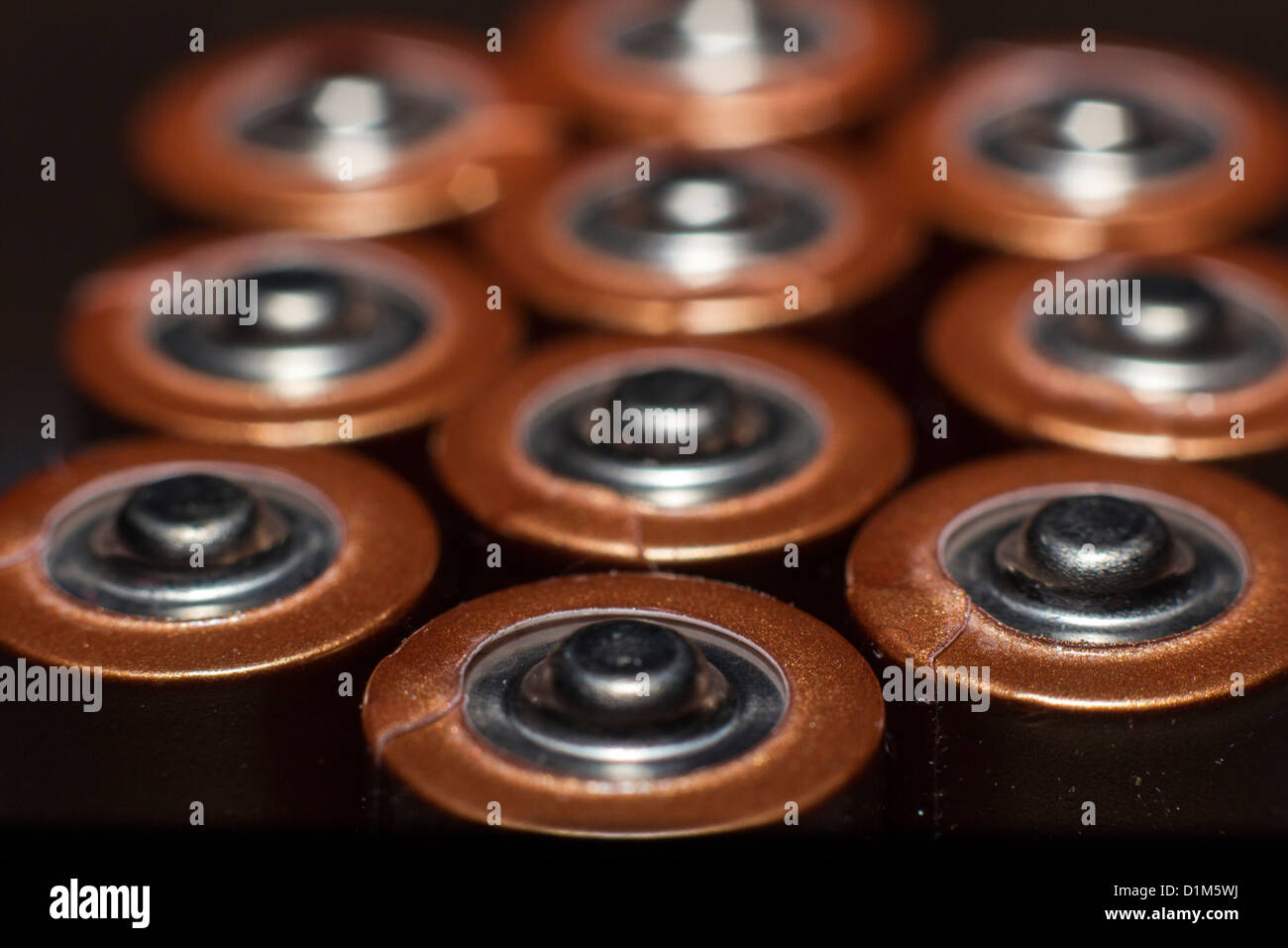 Positive terminals AA double A batteries. Duracell with focal point and ...