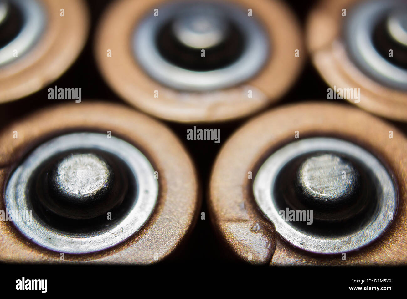 Positive terminals AA double A batteries. Duracell with focal point and ...