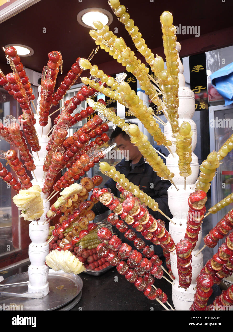 sweet hawthorn snack on a stick Stock Photo - Alamy