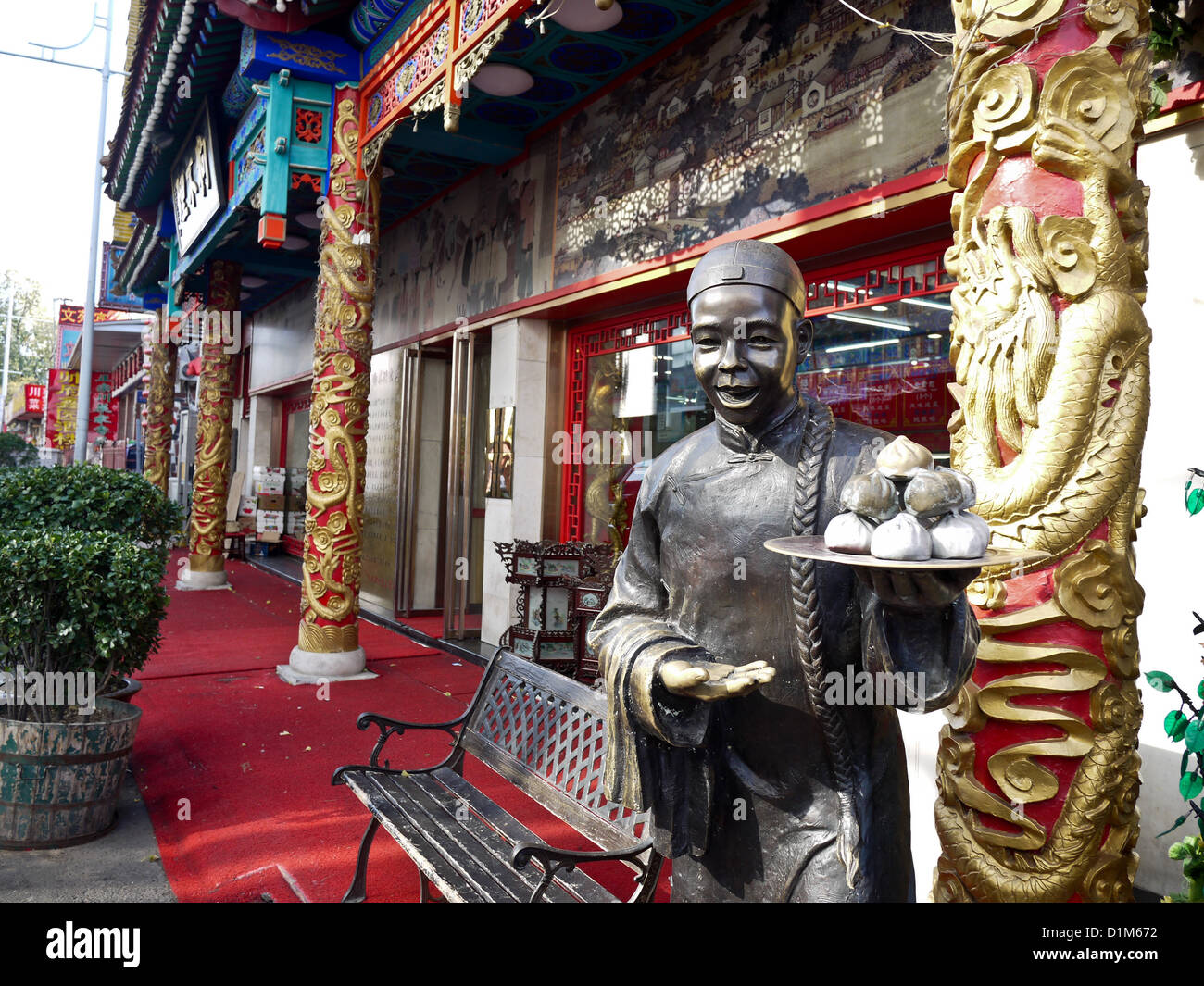 bronze statue "go believe" chinese steamed bun restaurant Stock Photo ...