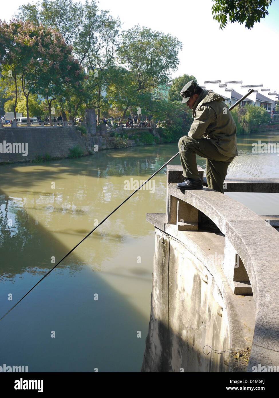 chinese man fishing river long pole male fisherman Stock Photo - Alamy