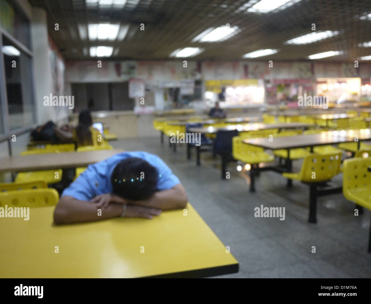 male worker sleeping table tired man napping Stock Photo - Alamy