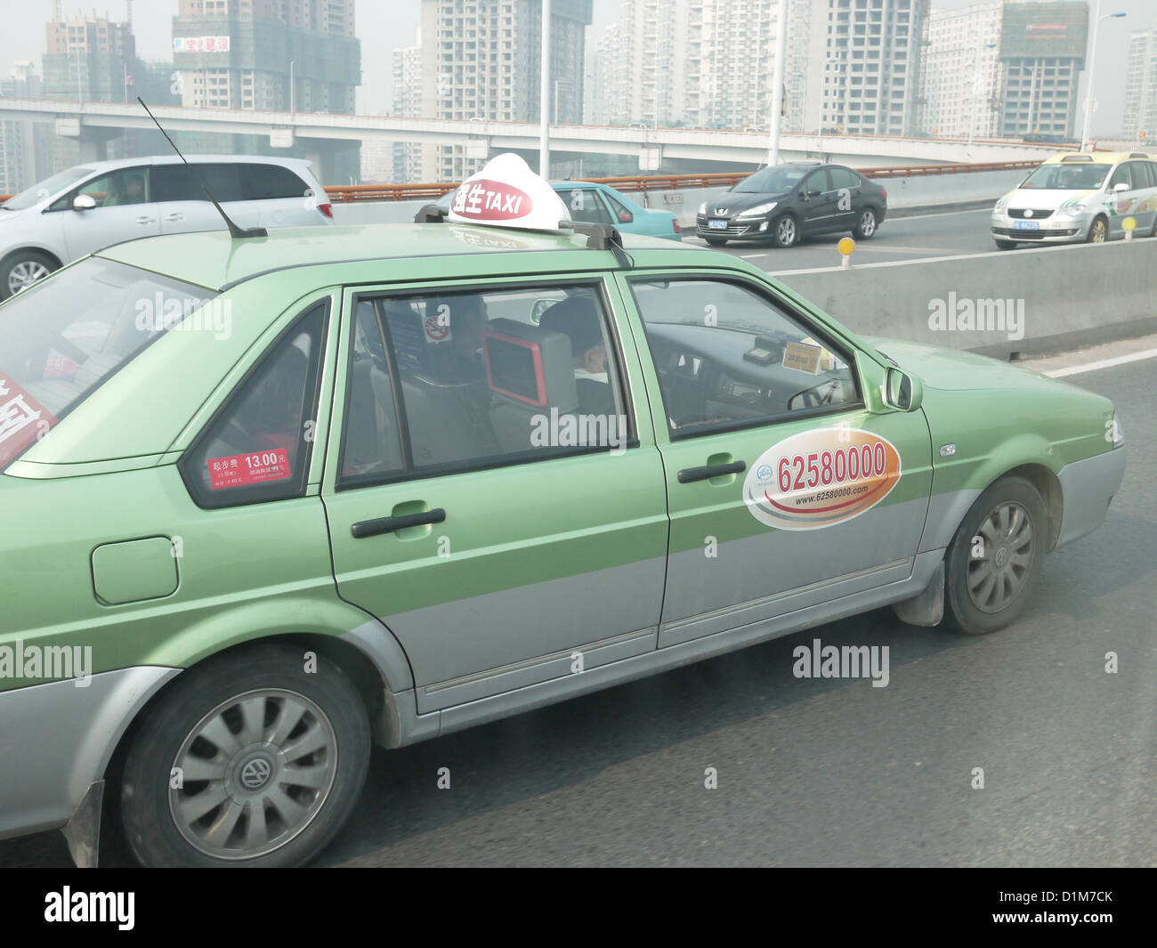 green taxi china Stock Photo - Alamy