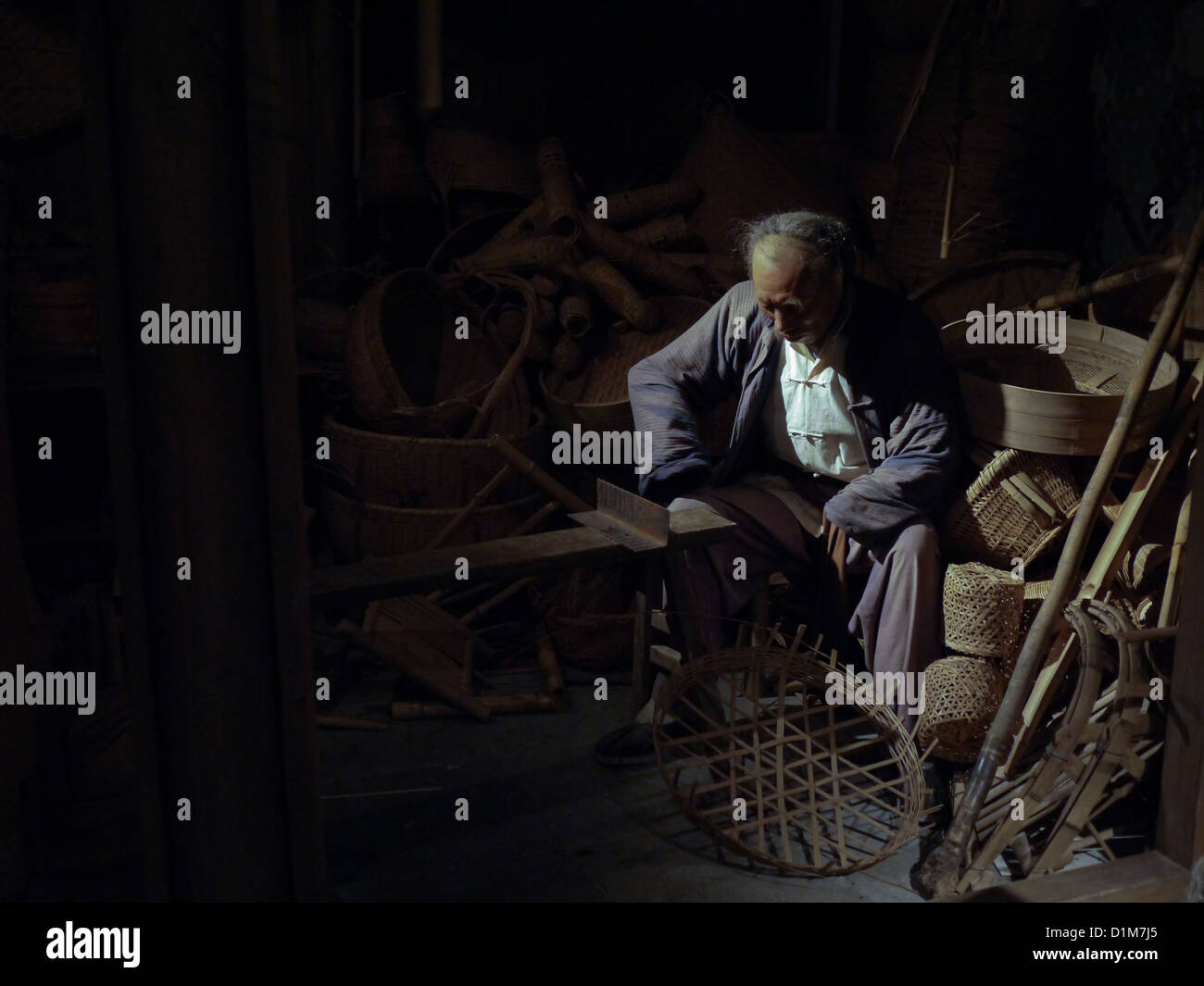 old chinese man resting sitting storage room Stock Photo - Alamy