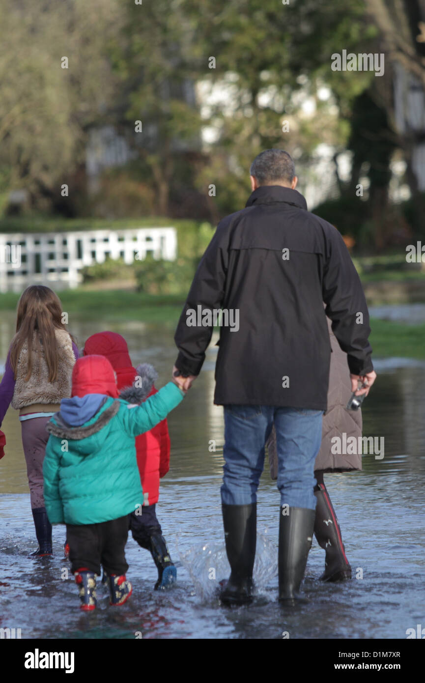 PEOPLE WALKING THROUGH FLOODED STREETS IN FEN DRAYTON,CAMBS AFTER HEAVY ...