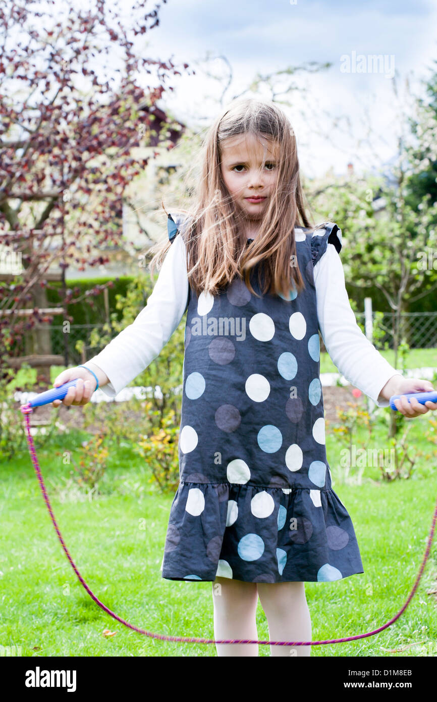Girl with jumping rope Stock Photo - Alamy