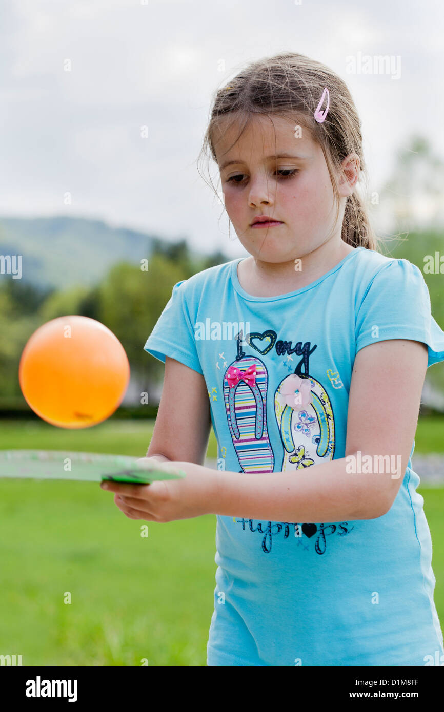 Girl playing with ball Stock Photo - Alamy