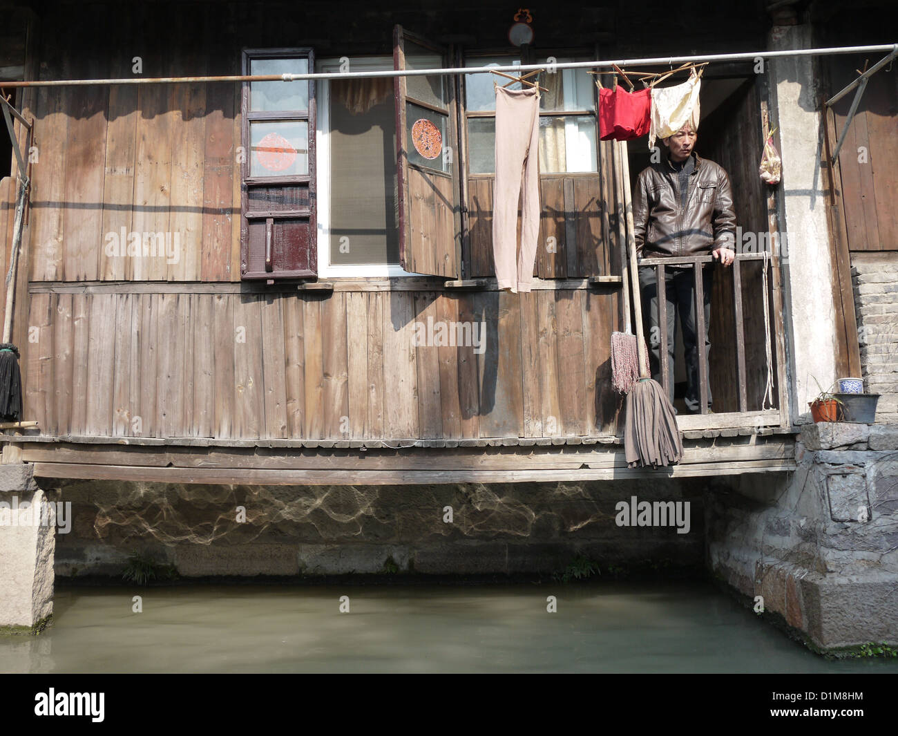 village residence looking out window poor house Stock Photo - Alamy
